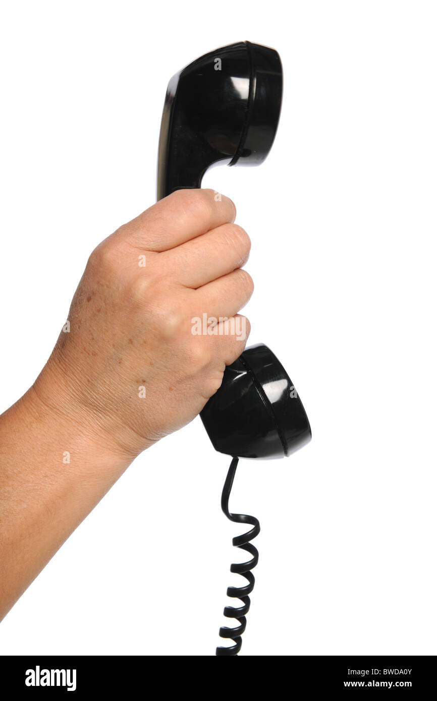 Hand holding vintage telephone receiver isolated over white background ...
