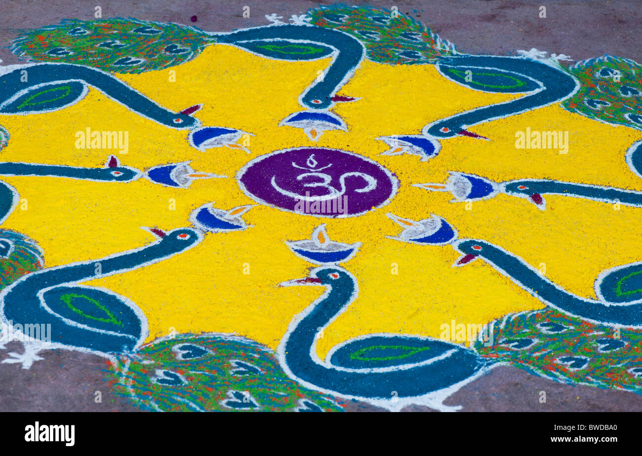 Colourful Sacred OM hindu Rangoli festival design in a street in ...