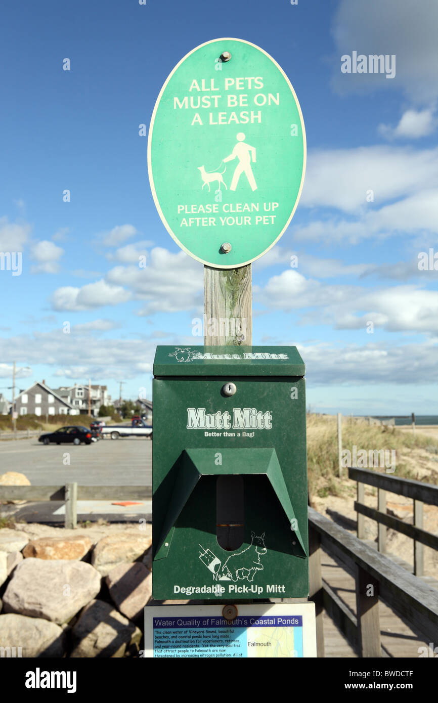 A sign indicating that all pets should be on a leash and a distributor ...