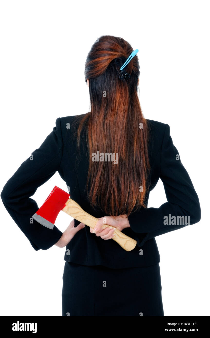 Businesswoman holding Axe behind her back Stock Photo - Alamy
