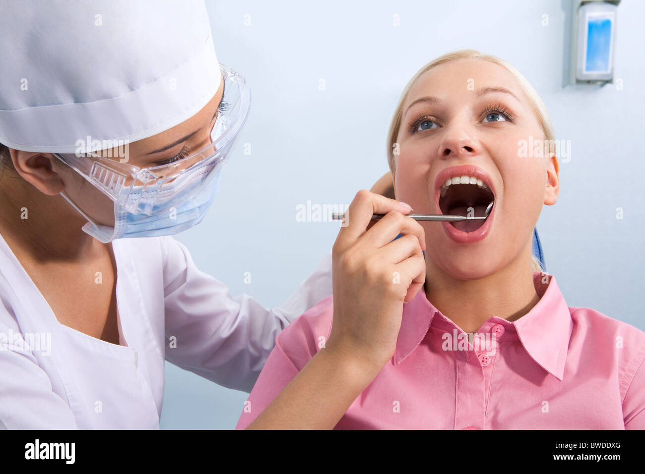 Image of young woman during inspection of oral cavity with help of ...