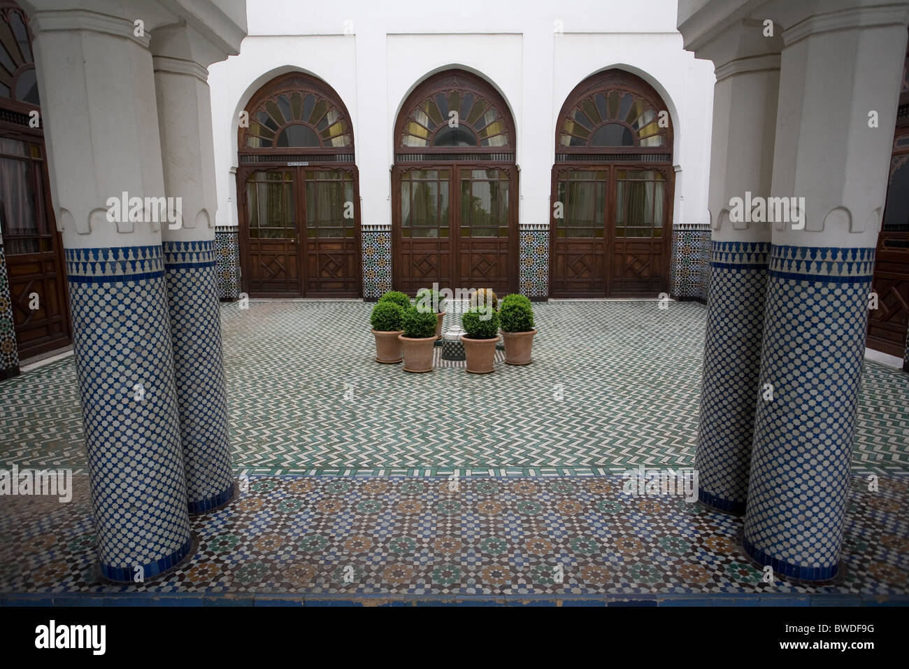 internal courtyard at la mosquée with pillars and floor decorated with ...