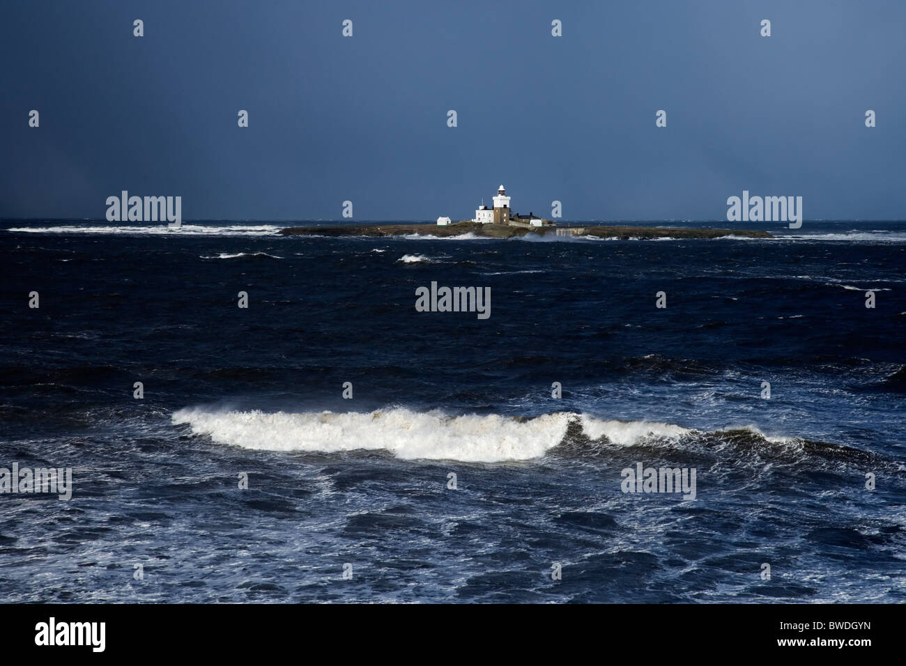Coquet Island Lighthouse in storm light and rough seas Stock Photo - Alamy