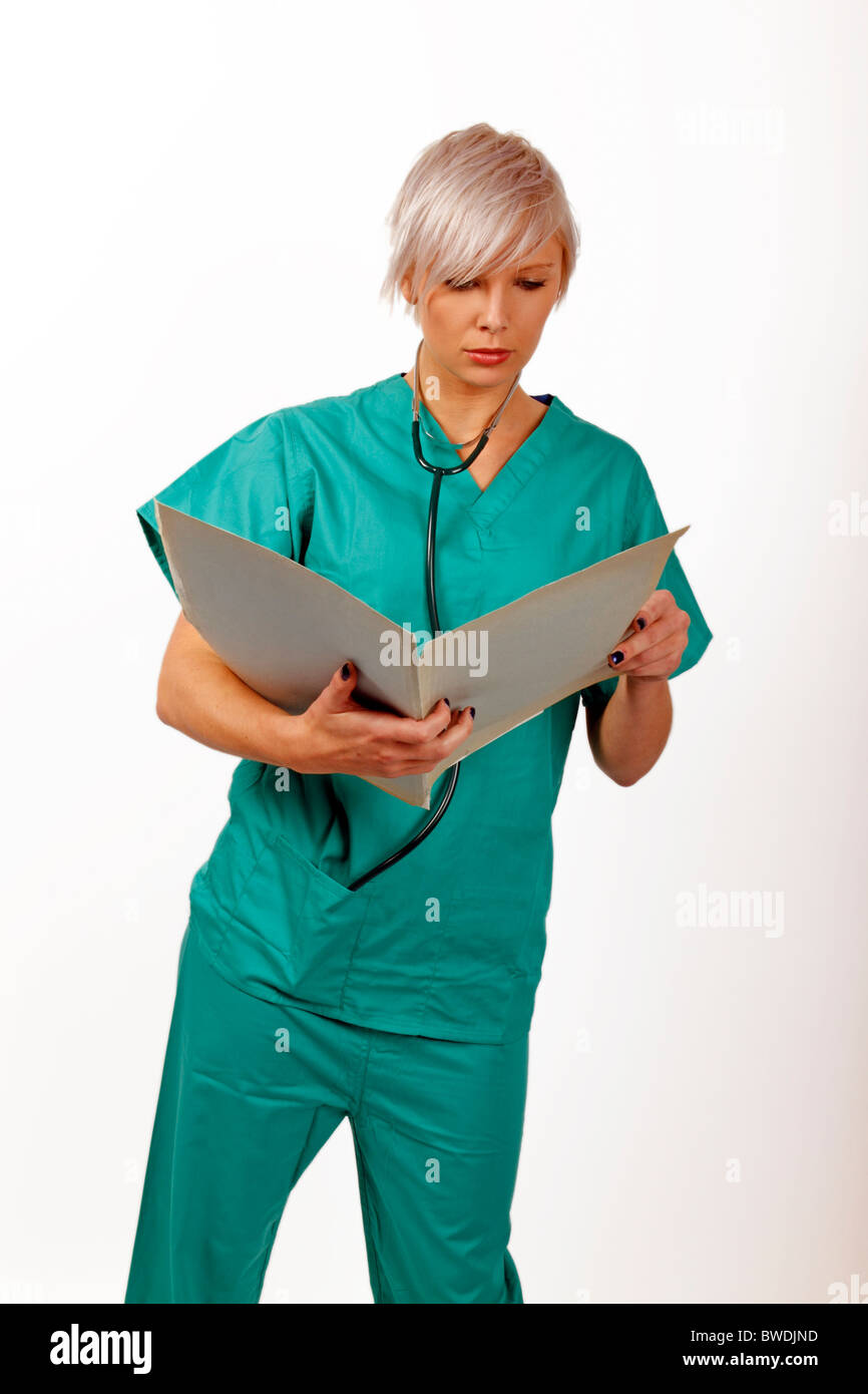 Young female doctor holding patients notes Stock Photo - Alamy