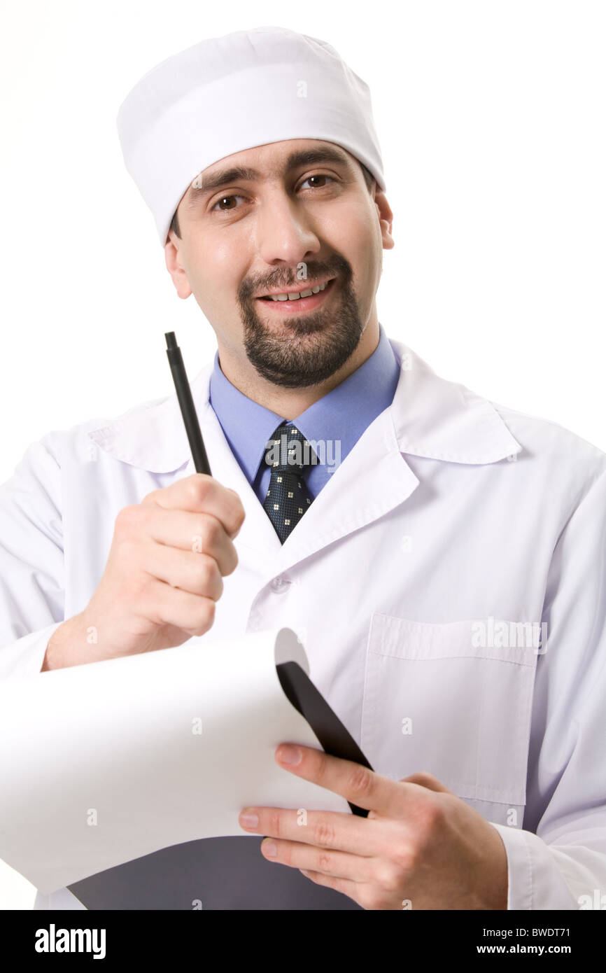 Portrait of confident doctor prescribing medicine and looking at camera ...