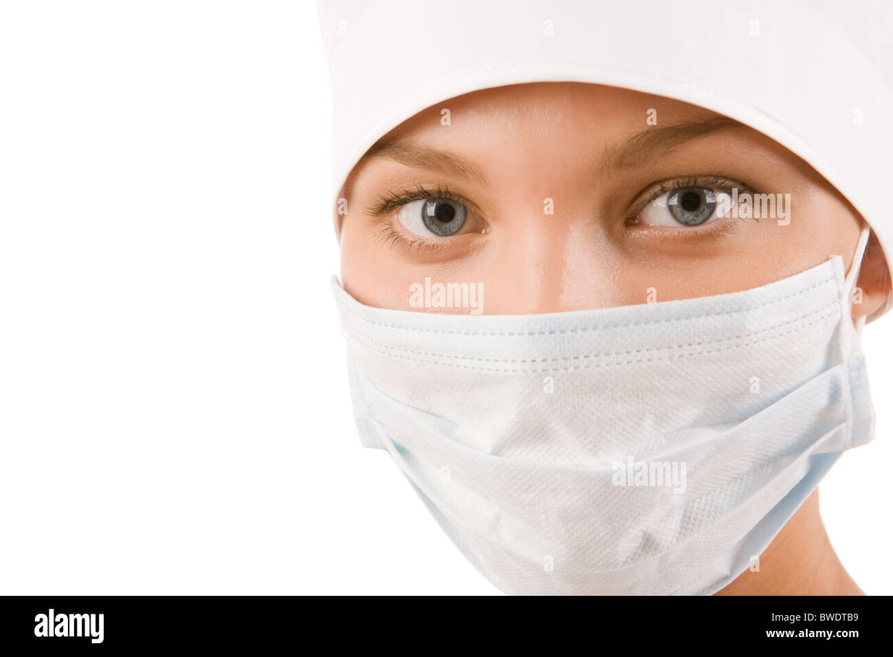 Face of nurse in sterile mask looking at camera Stock Photo - Alamy