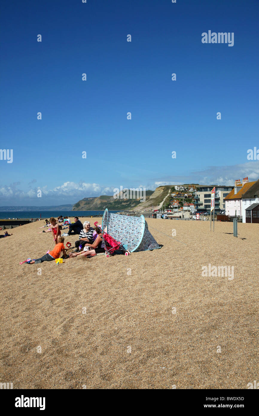Enjoying a day on Chesil Beach at West Bay, a popular seaside resort ...