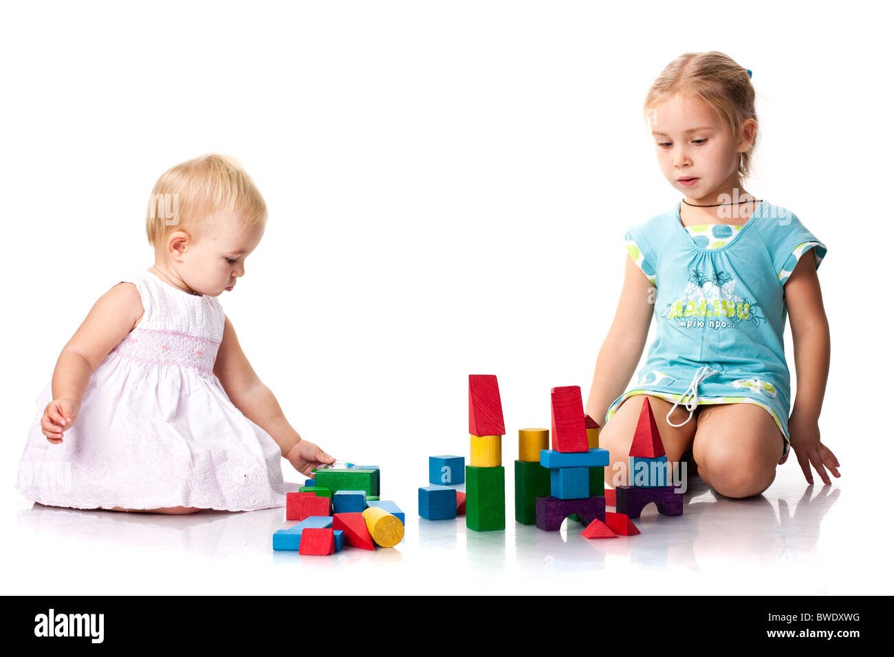Children building a castle with cubes isolated on white Stock Photo - Alamy