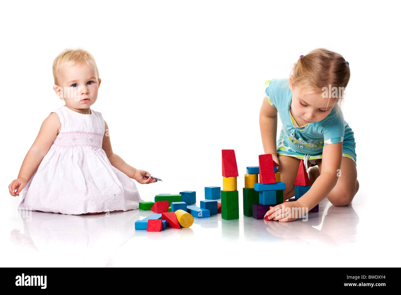 Children building a castle with cubes isolated on white Stock Photo - Alamy
