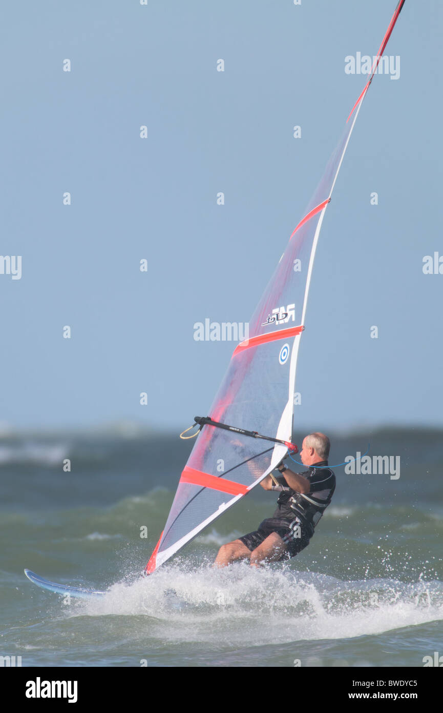 A windsurfer catches a wave on Tampa Bay on the waters just off Fort ...