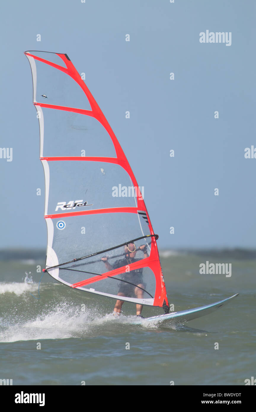 A windsurfer catches a wave on Tampa Bay on the waters just off Fort ...