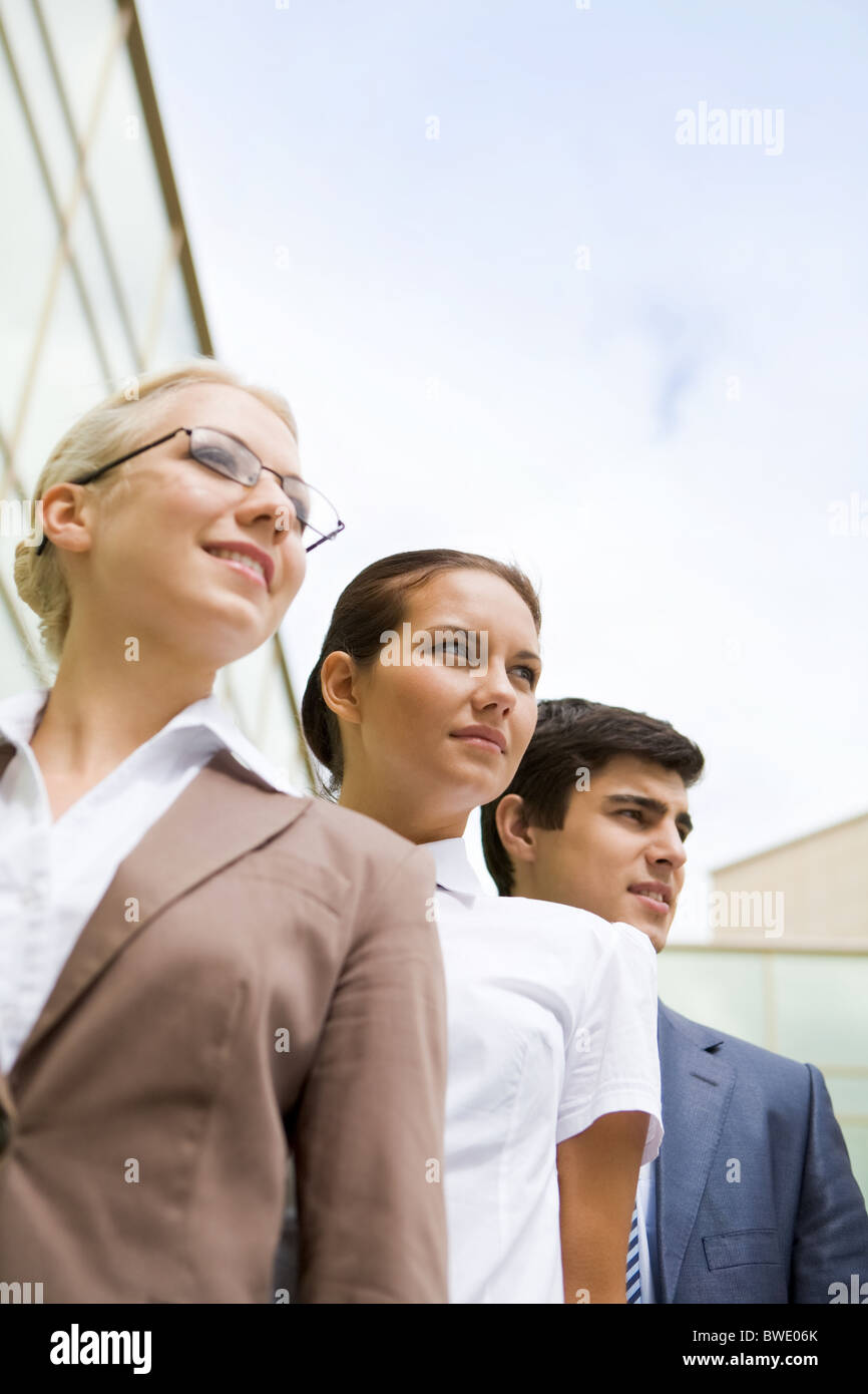 Portrait of friendly business group standing in line Stock Photo - Alamy