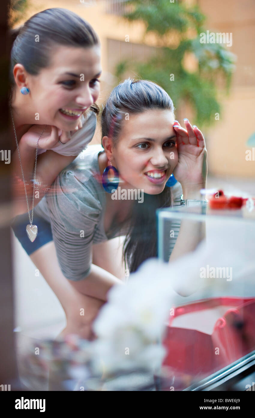 Young women window shopping Stock Photo - Alamy