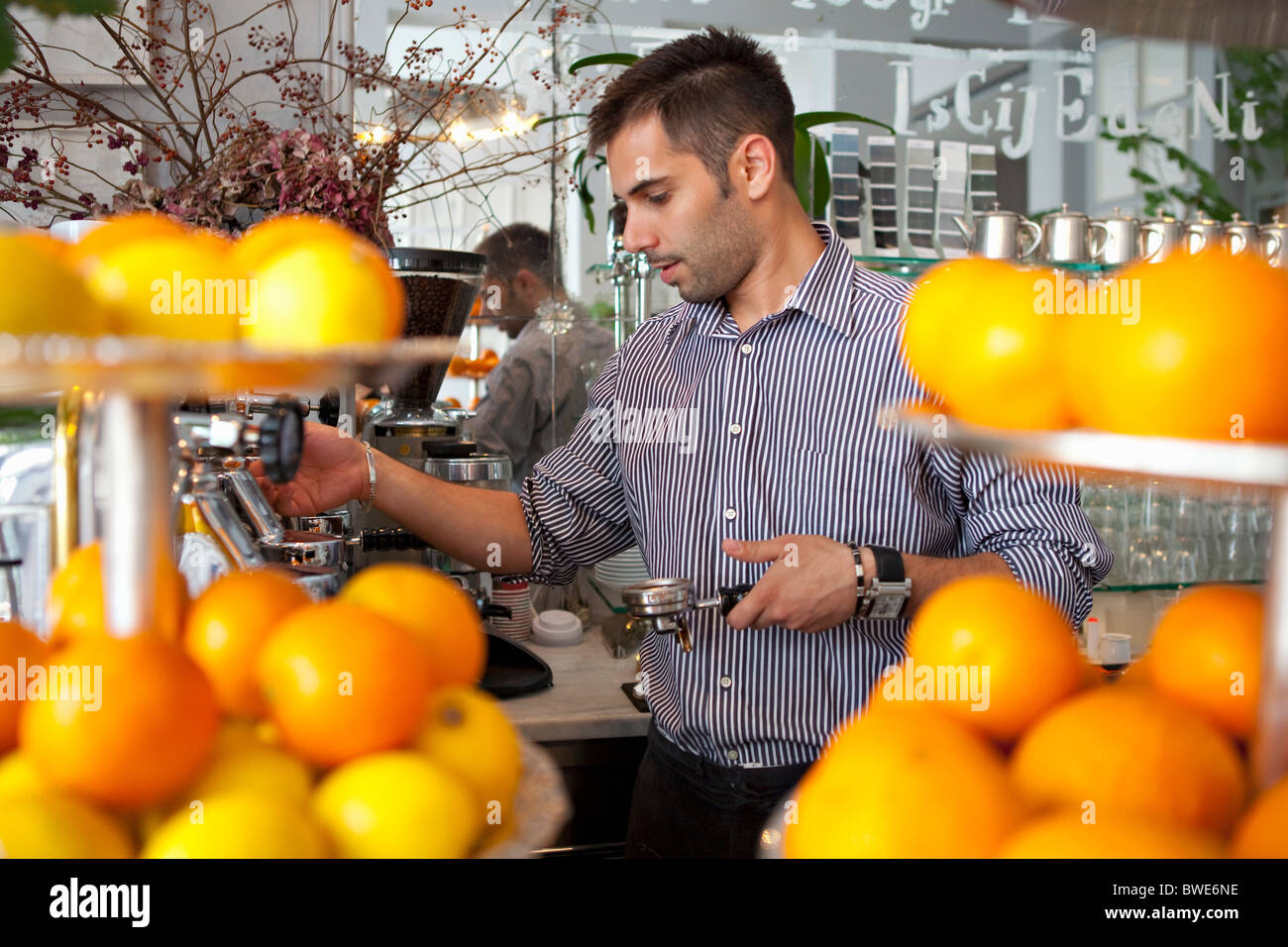 Barkeeper making coffee Stock Photo - Alamy