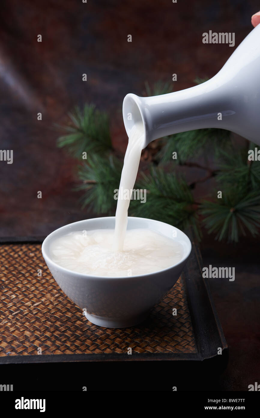pouring Korean traditional alcohol made from grain Stock Photo - Alamy