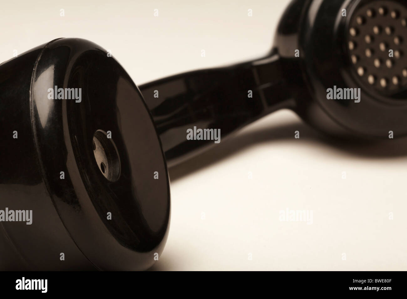 black old bt telephone on white background close up detail of hand set ...