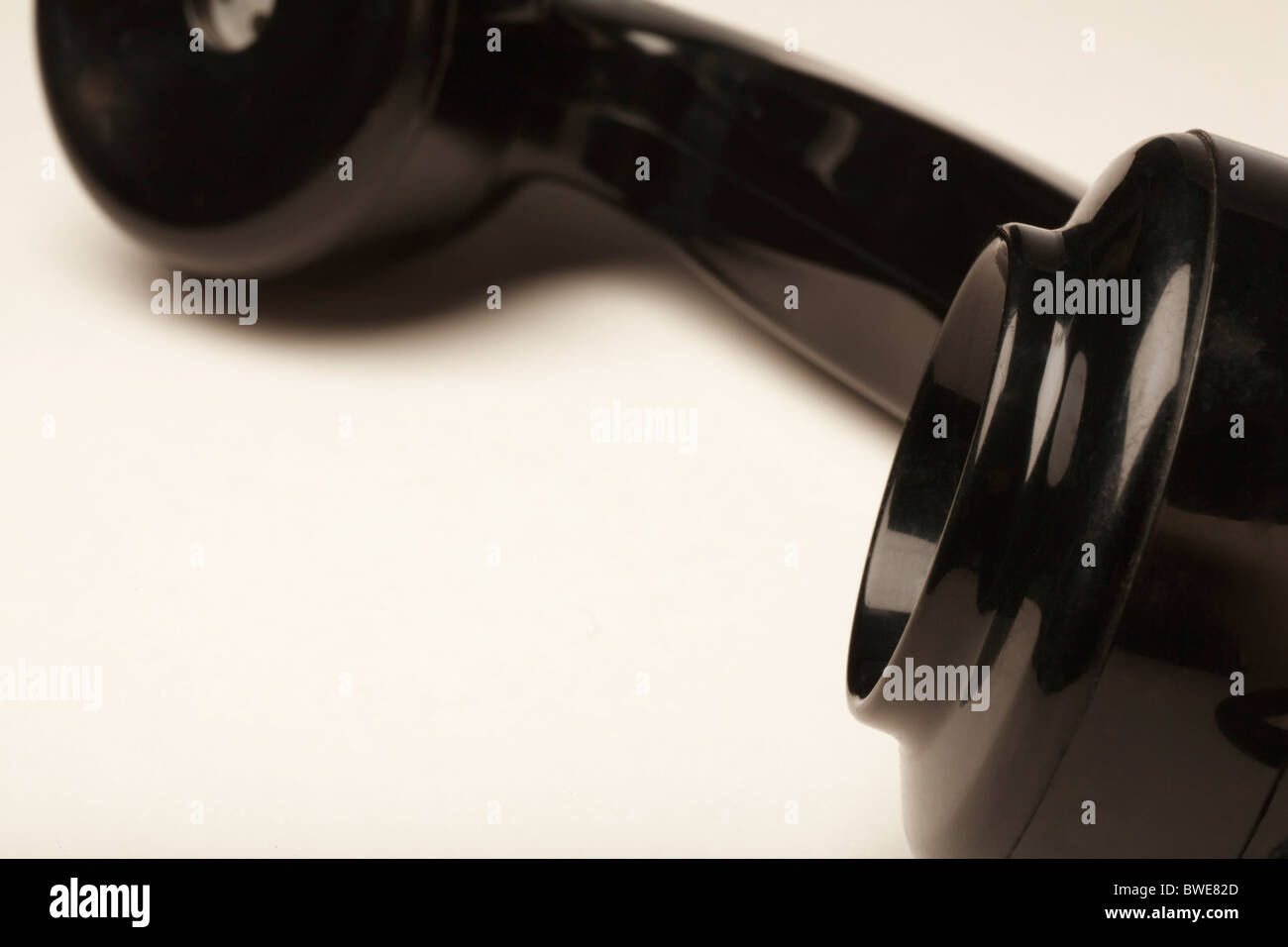 black old bt telephone on white background close up detail of hand set ...