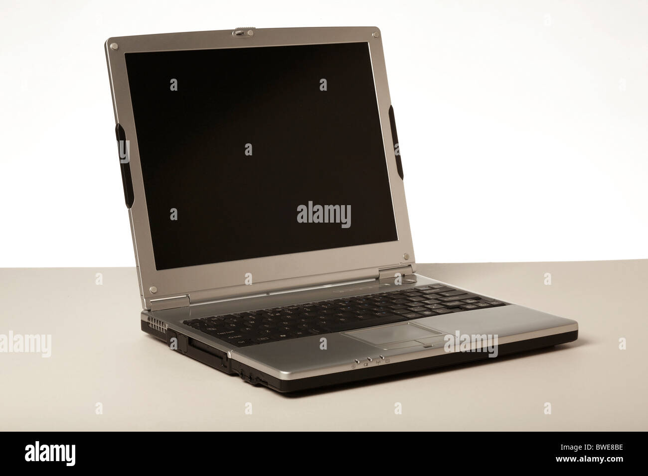single laptop computer on white background Stock Photo - Alamy