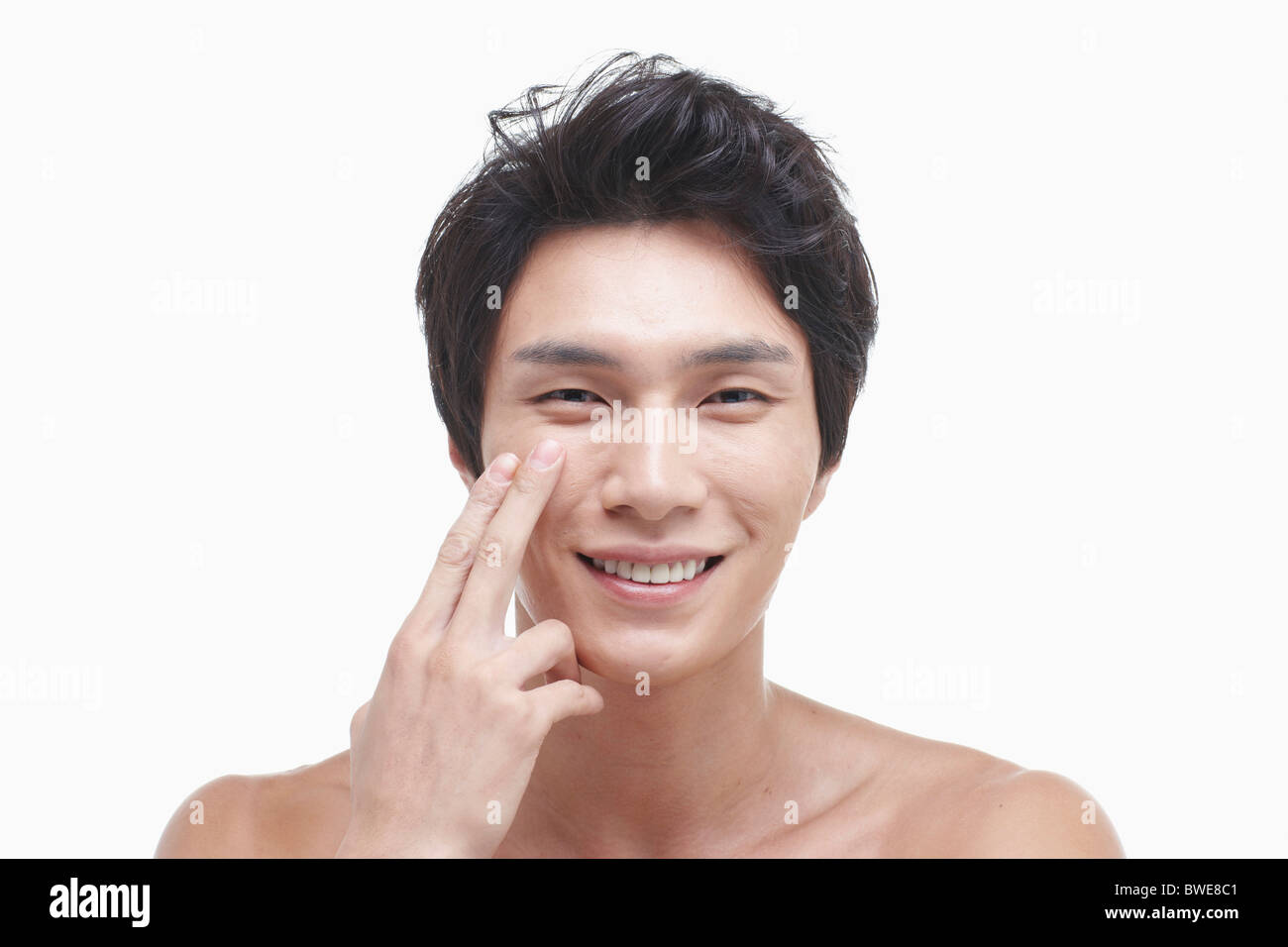 guy touchung his chin Stock Photo - Alamy