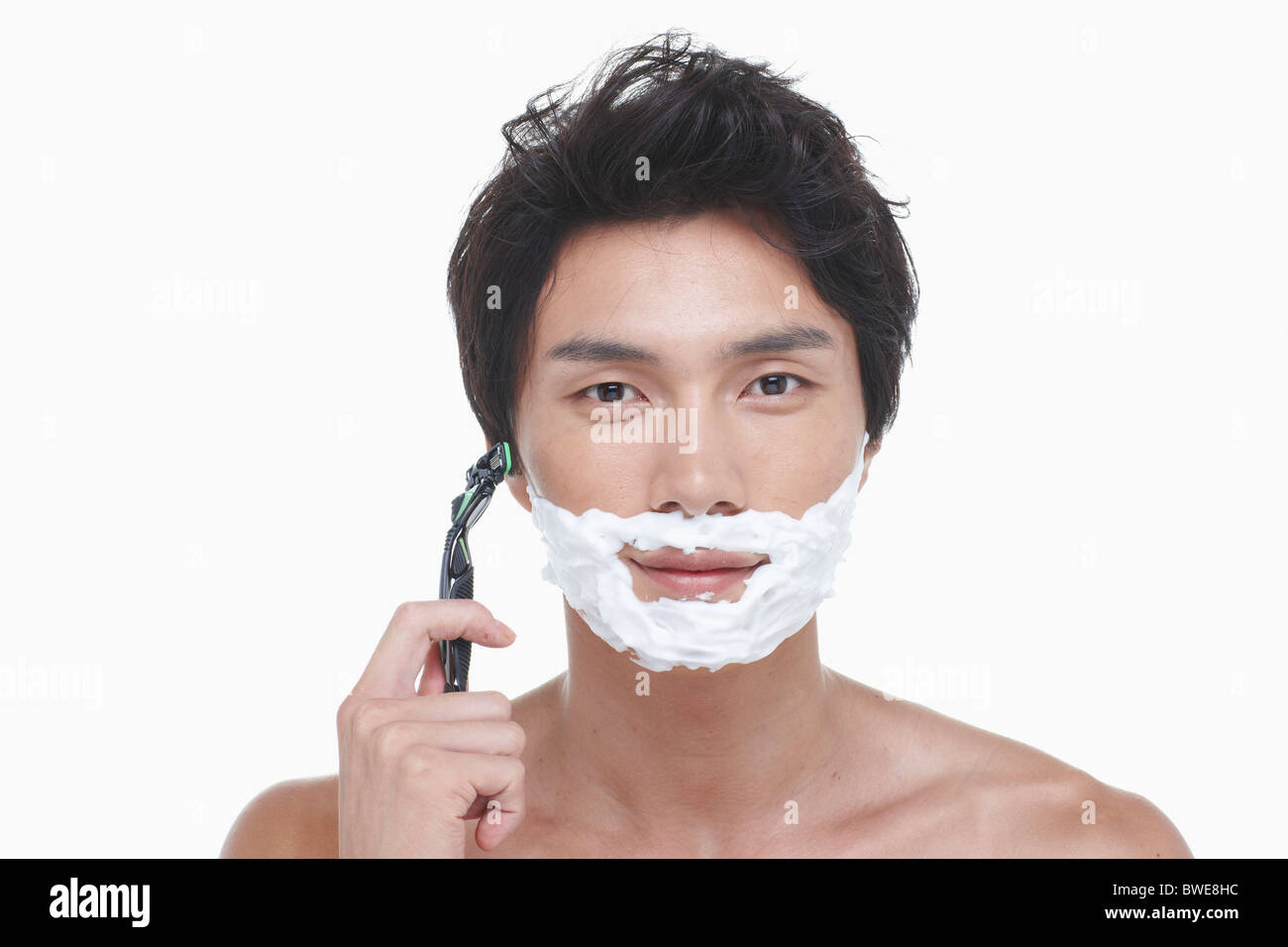 guy is shaving his face with razor Stock Photo - Alamy