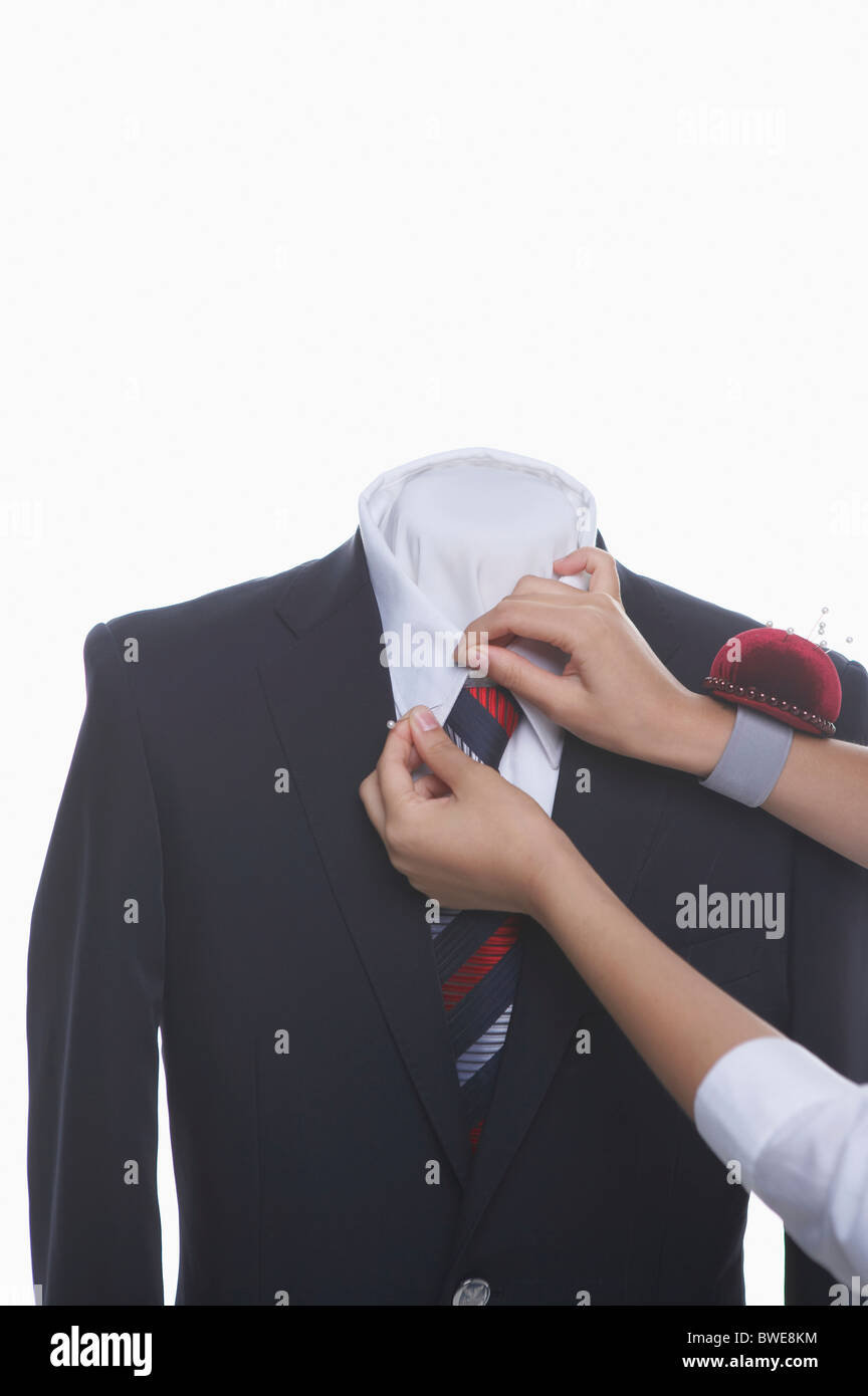 hands pinning on the shirt Stock Photo - Alamy