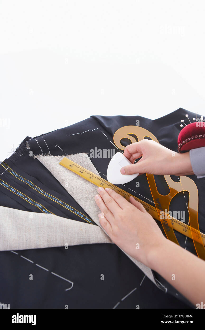 hands chalking on the fabric Stock Photo - Alamy