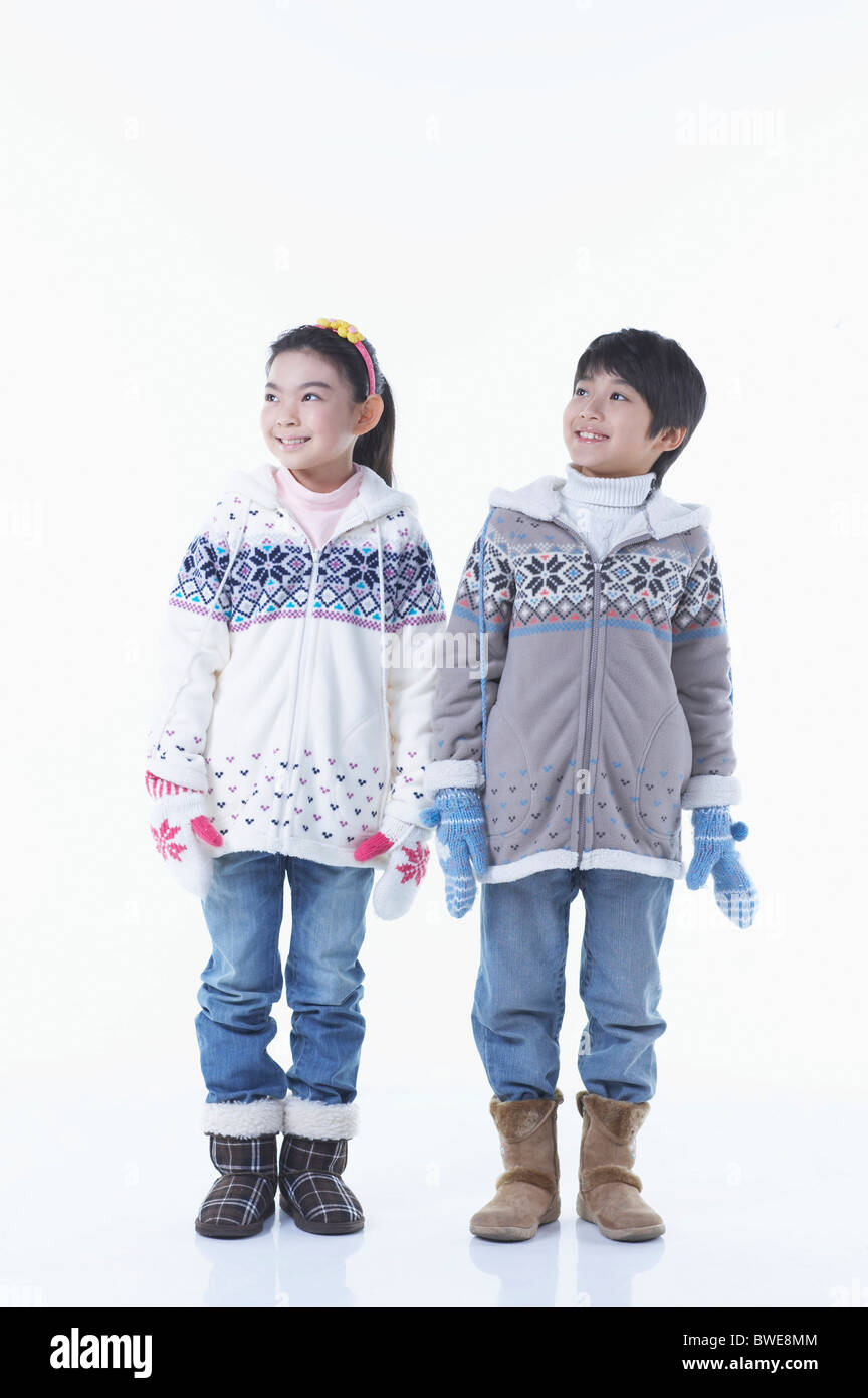 boy and girl wearing winter outer Stock Photo - Alamy