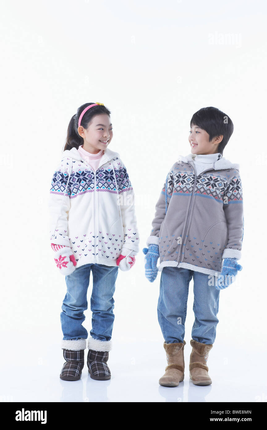 boy and girl wearing winter outer Stock Photo - Alamy