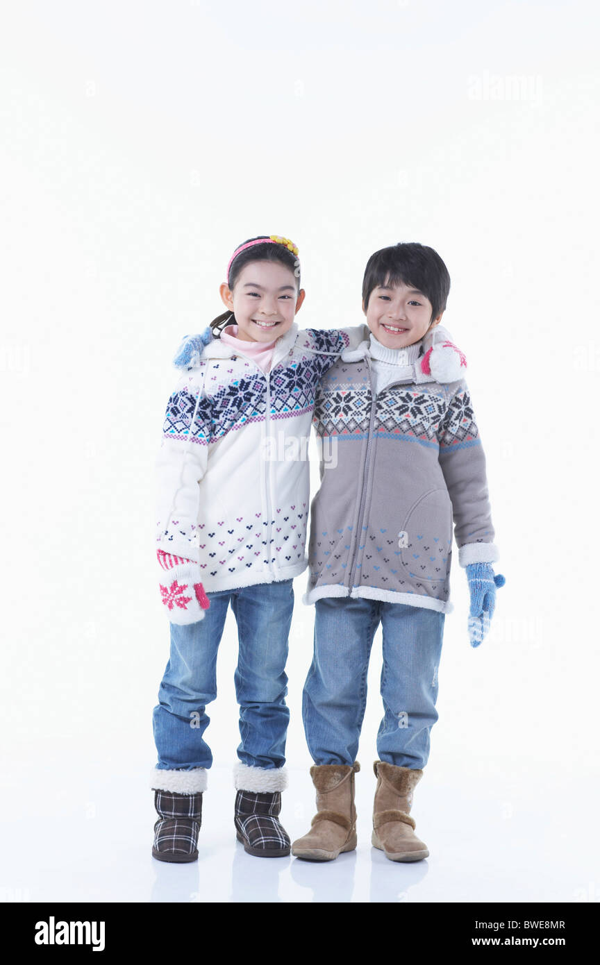 boy and girl wearing winter outer Stock Photo - Alamy