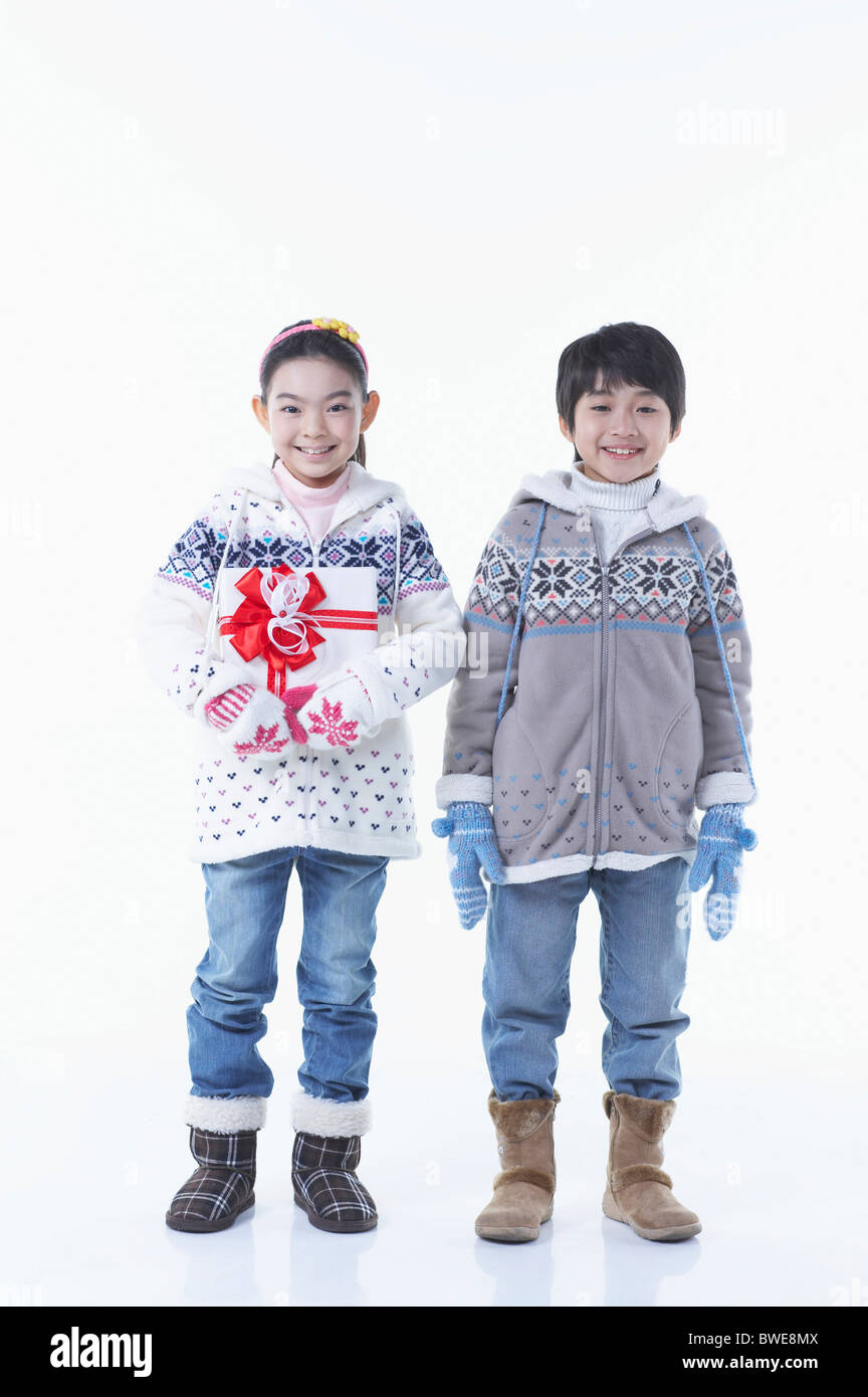 boy and girl wearing winter outer Stock Photo - Alamy
