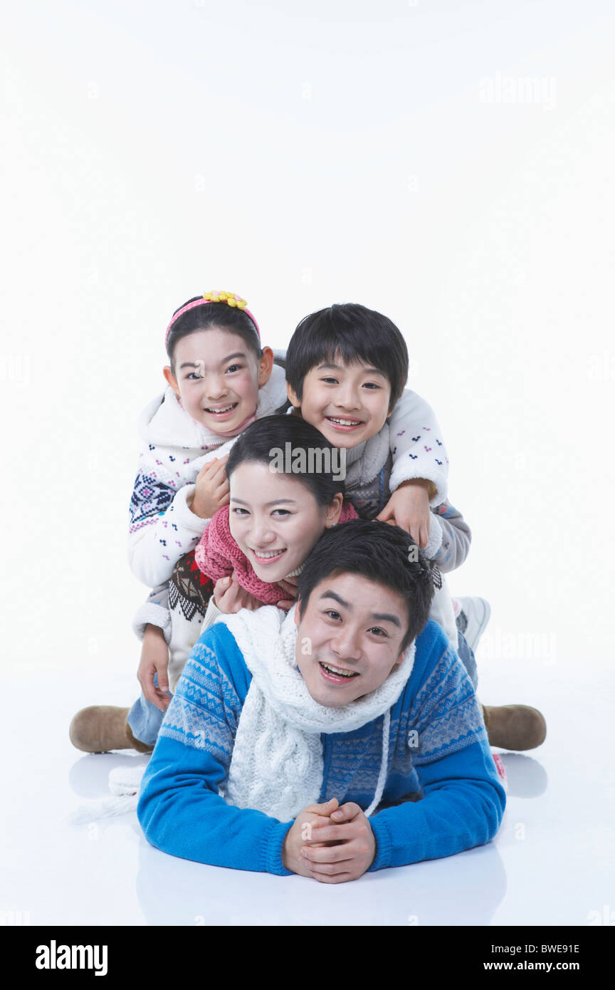 family members sitting in a row with smile Stock Photo - Alamy