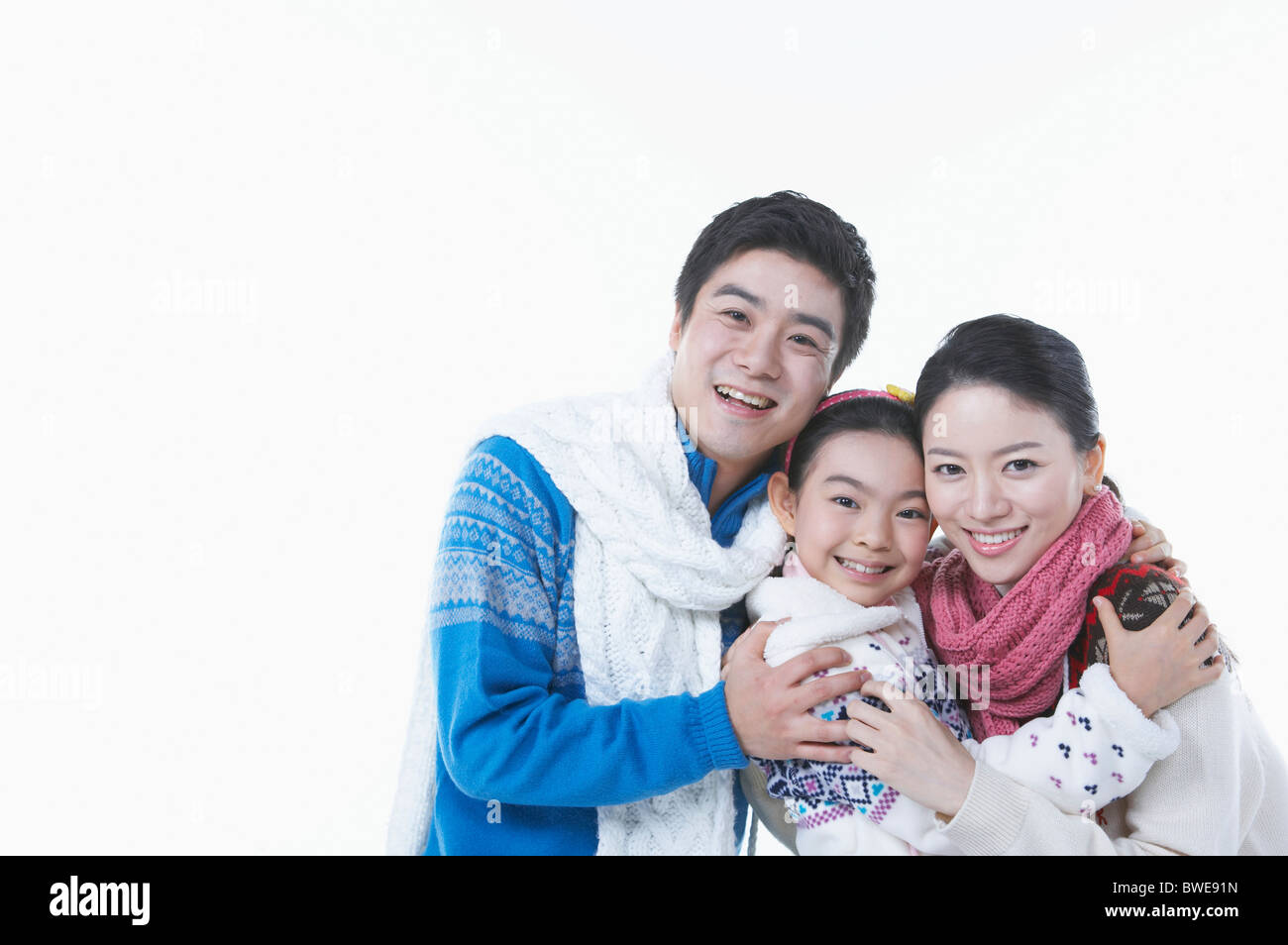 parents and girl is hugging each other Stock Photo - Alamy