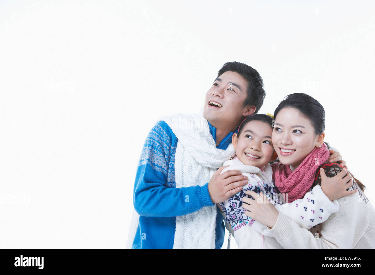 parents and girl is hugging each other Stock Photo - Alamy
