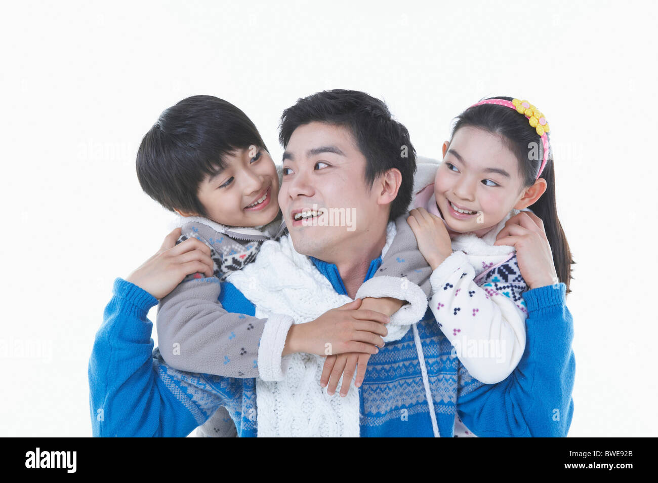 children hugging his father Stock Photo - Alamy