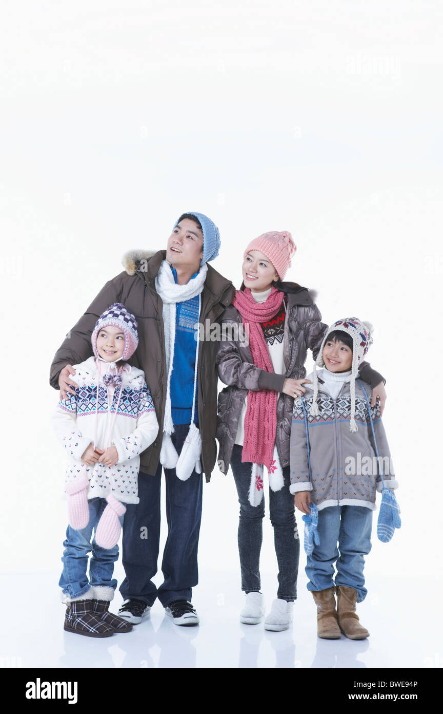 family wearing winter outfit and winter items Stock Photo - Alamy