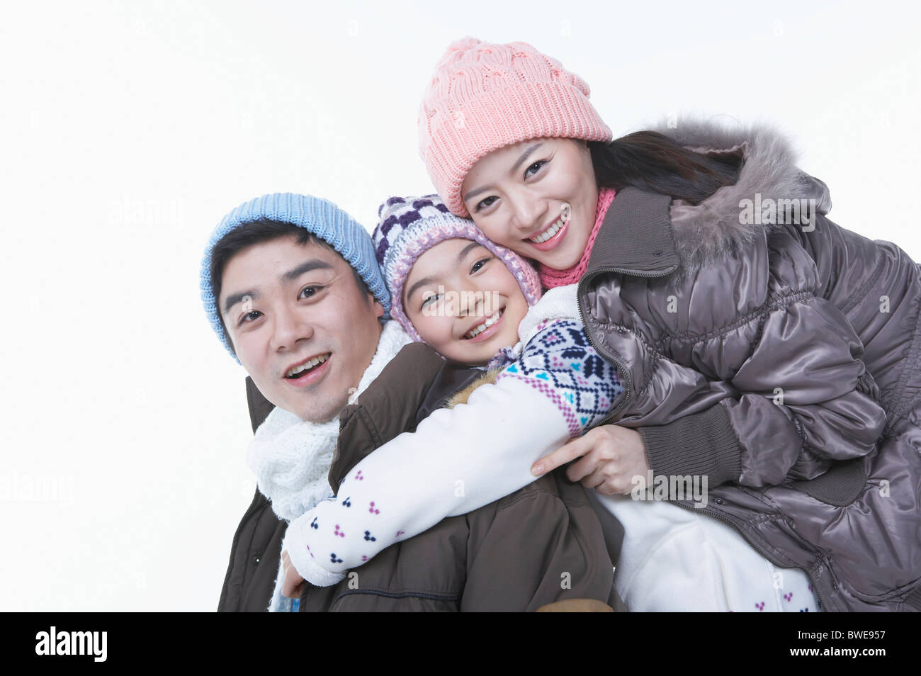 parents and daughter hugging each other Stock Photo - Alamy