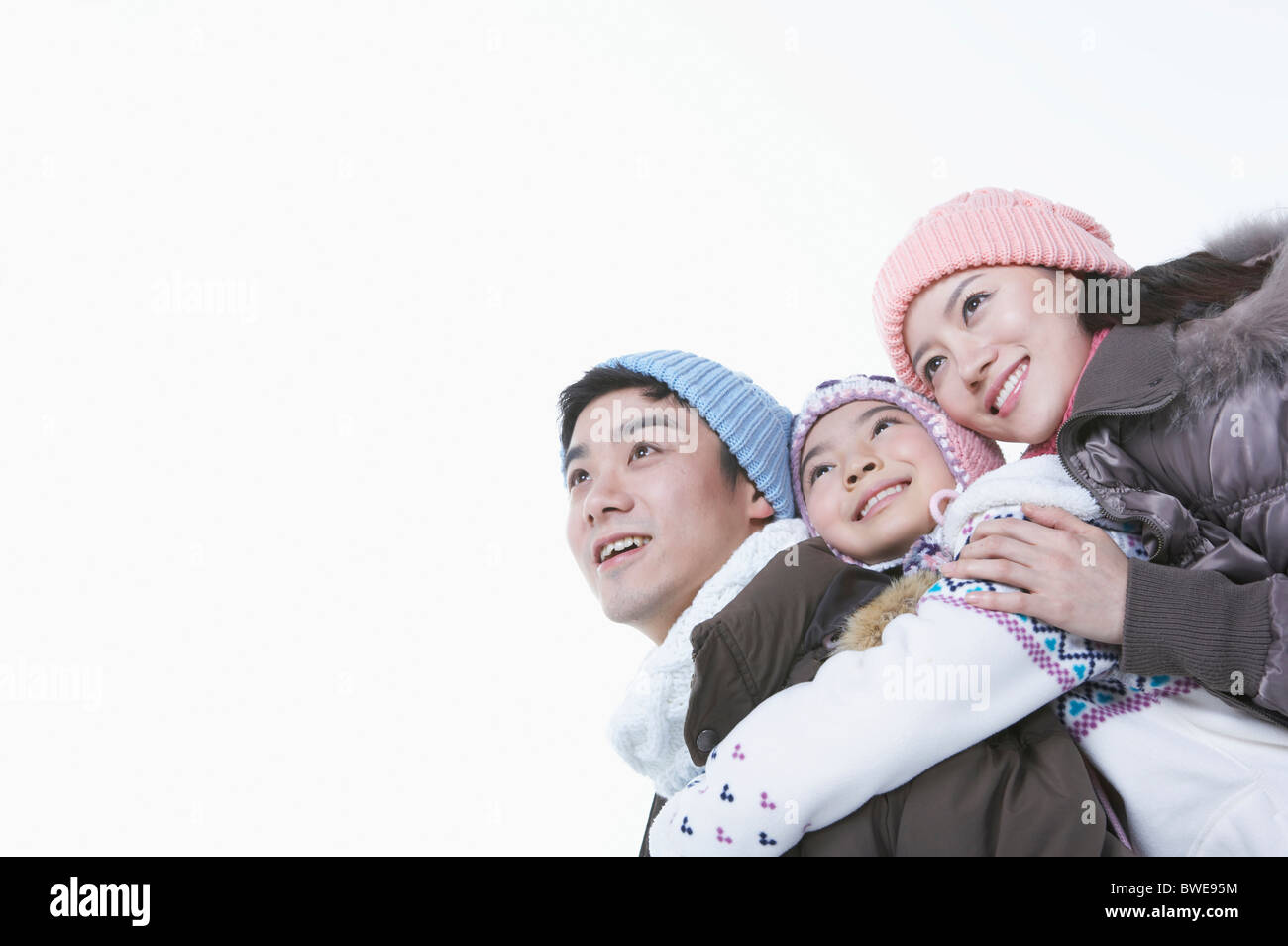 parents and daughter hugging each other Stock Photo - Alamy