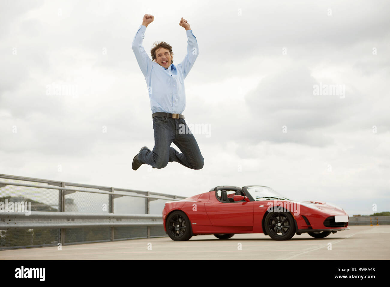 Super Man Jumping Over Car