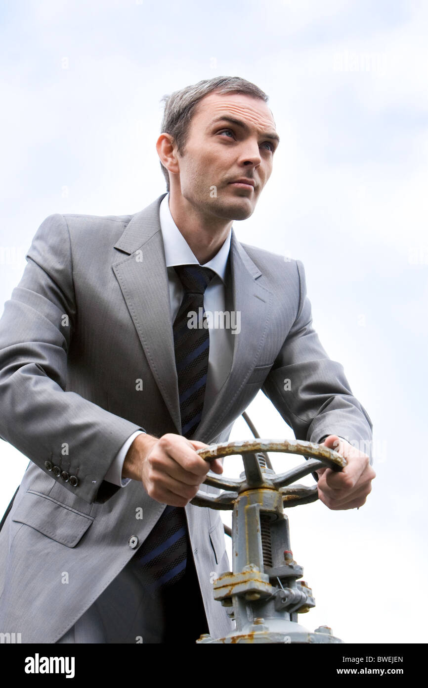 Portrait of strong leader steering on background of sky Stock Photo - Alamy