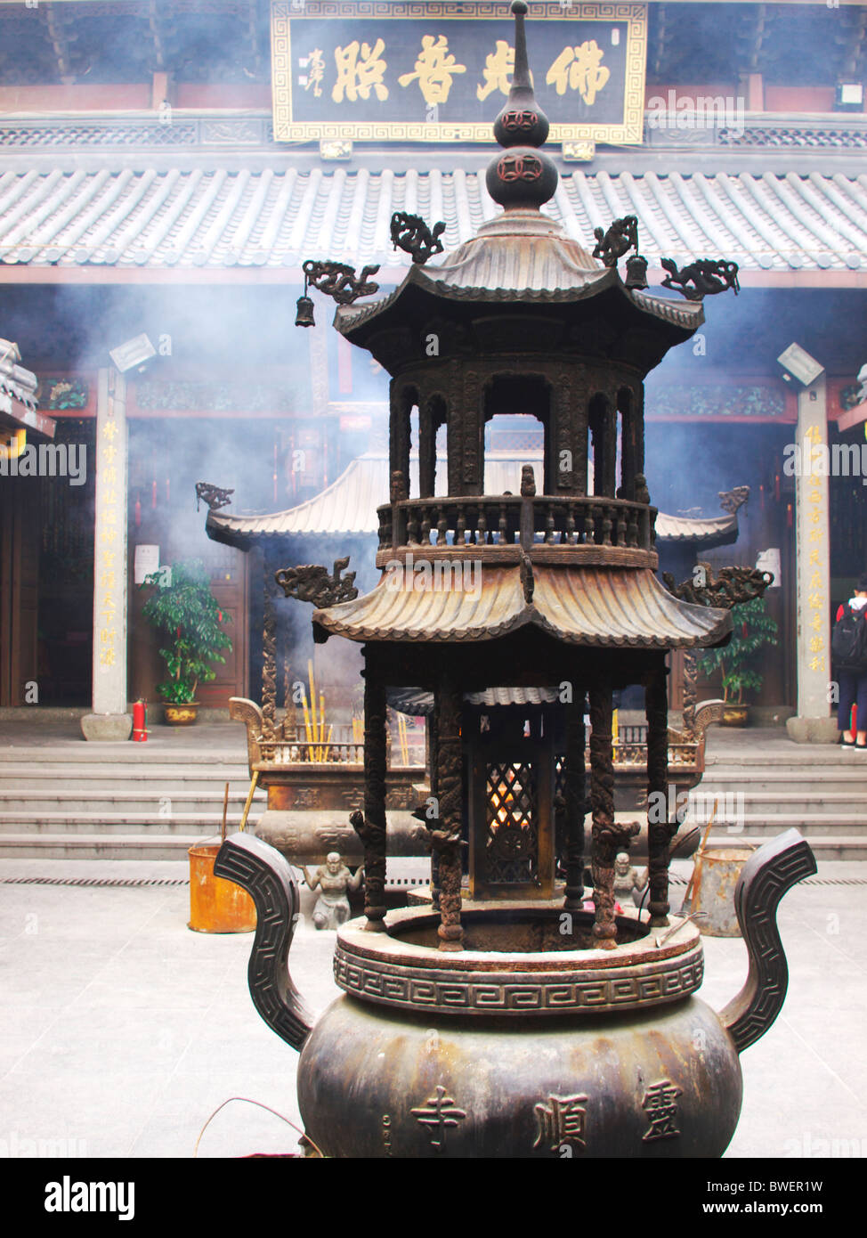Inside a Buddhist temple in Hangzhou in China, with smoke coming from ...