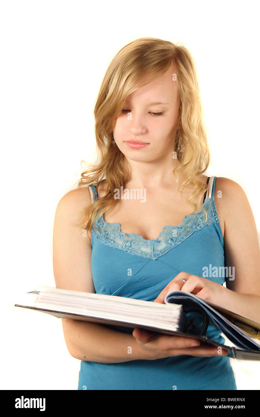 A young ambitious student reading. All isolated on white background ...