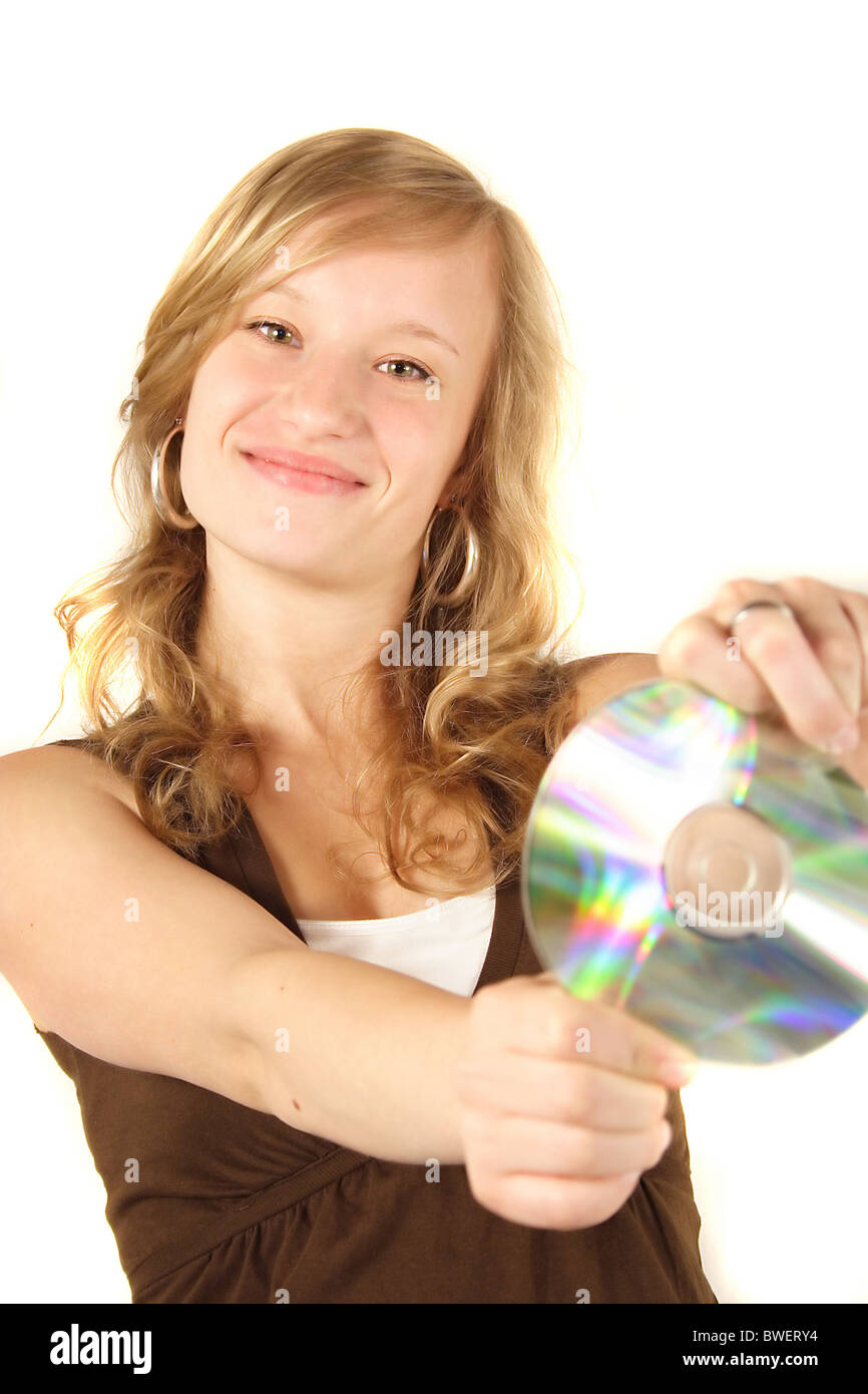 A young woman bending a cd or dvd. All isolated on white background ...