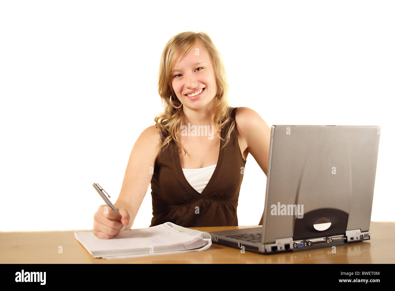 A young smarting woman at her workplace. All isolated on white ...