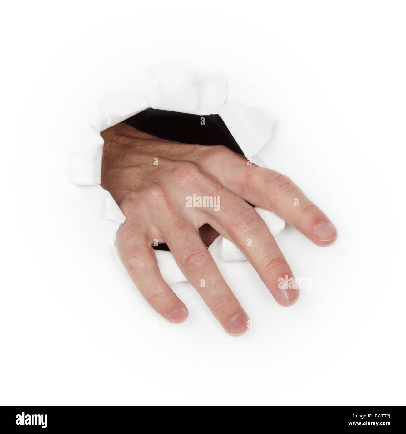 Man's hand breaks through the white paper Stock Photo - Alamy