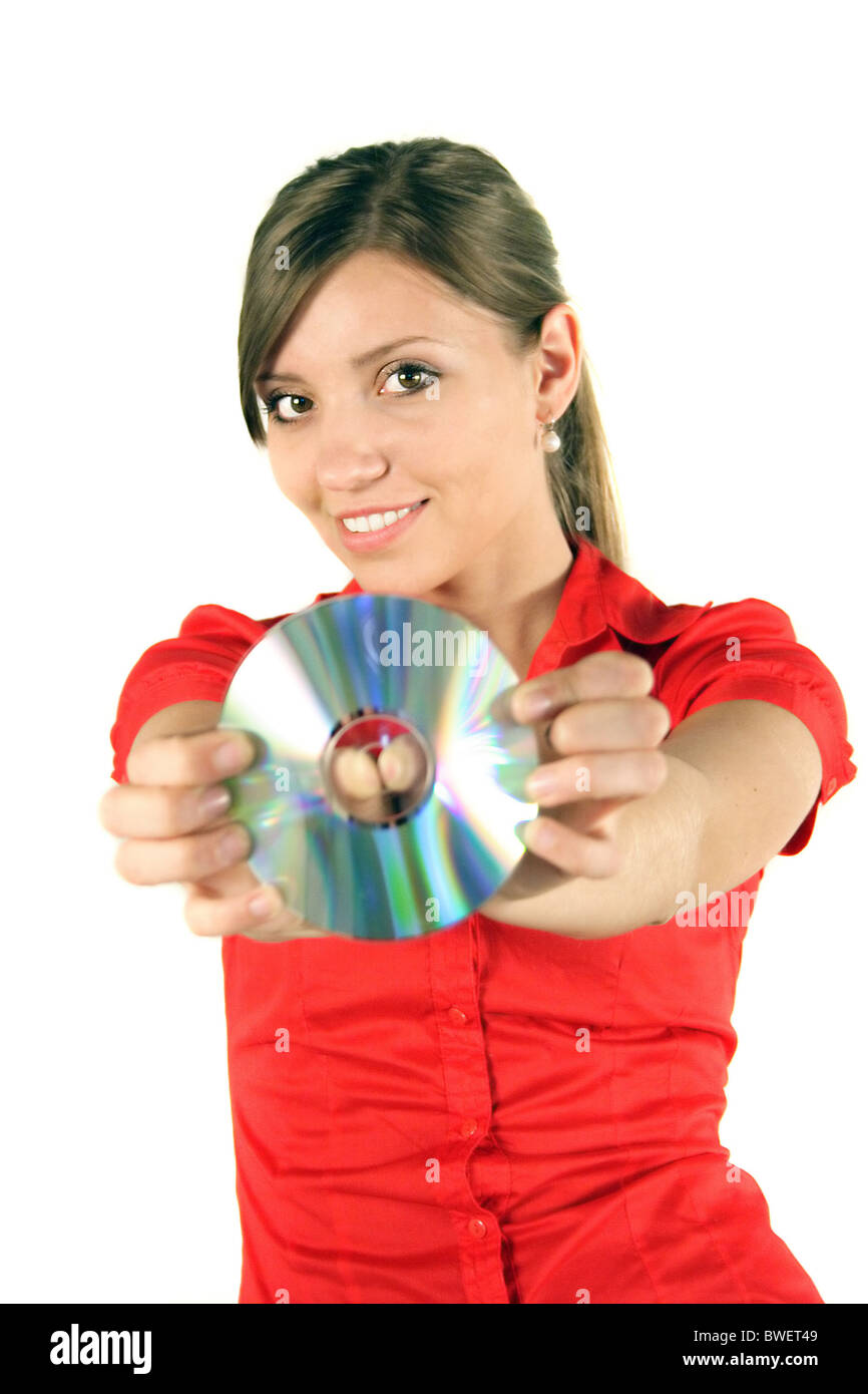 A young woman bending a cd or dvd. All isolated on white background ...