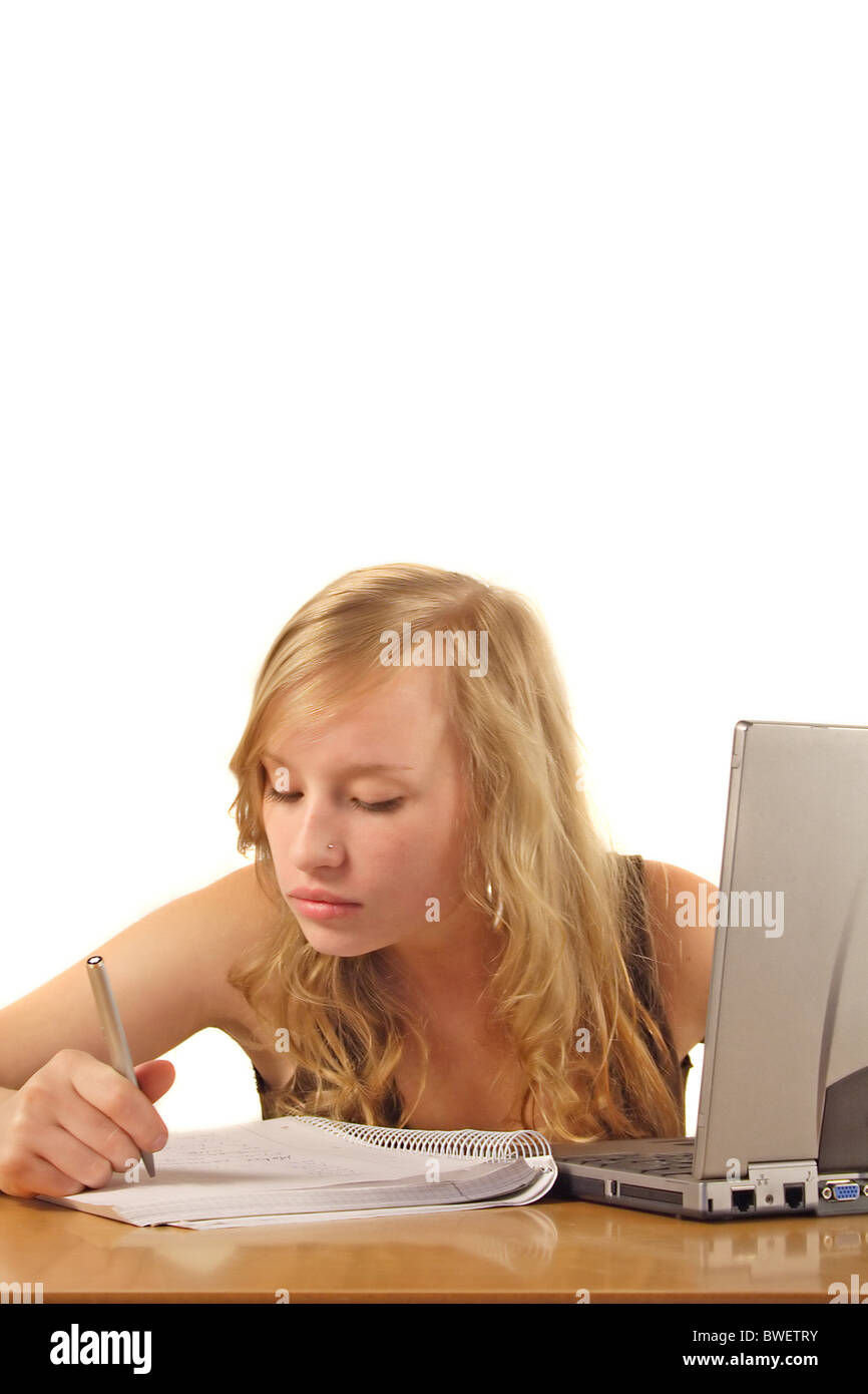 A young smarting woman at her workplace. All isolated on white ...