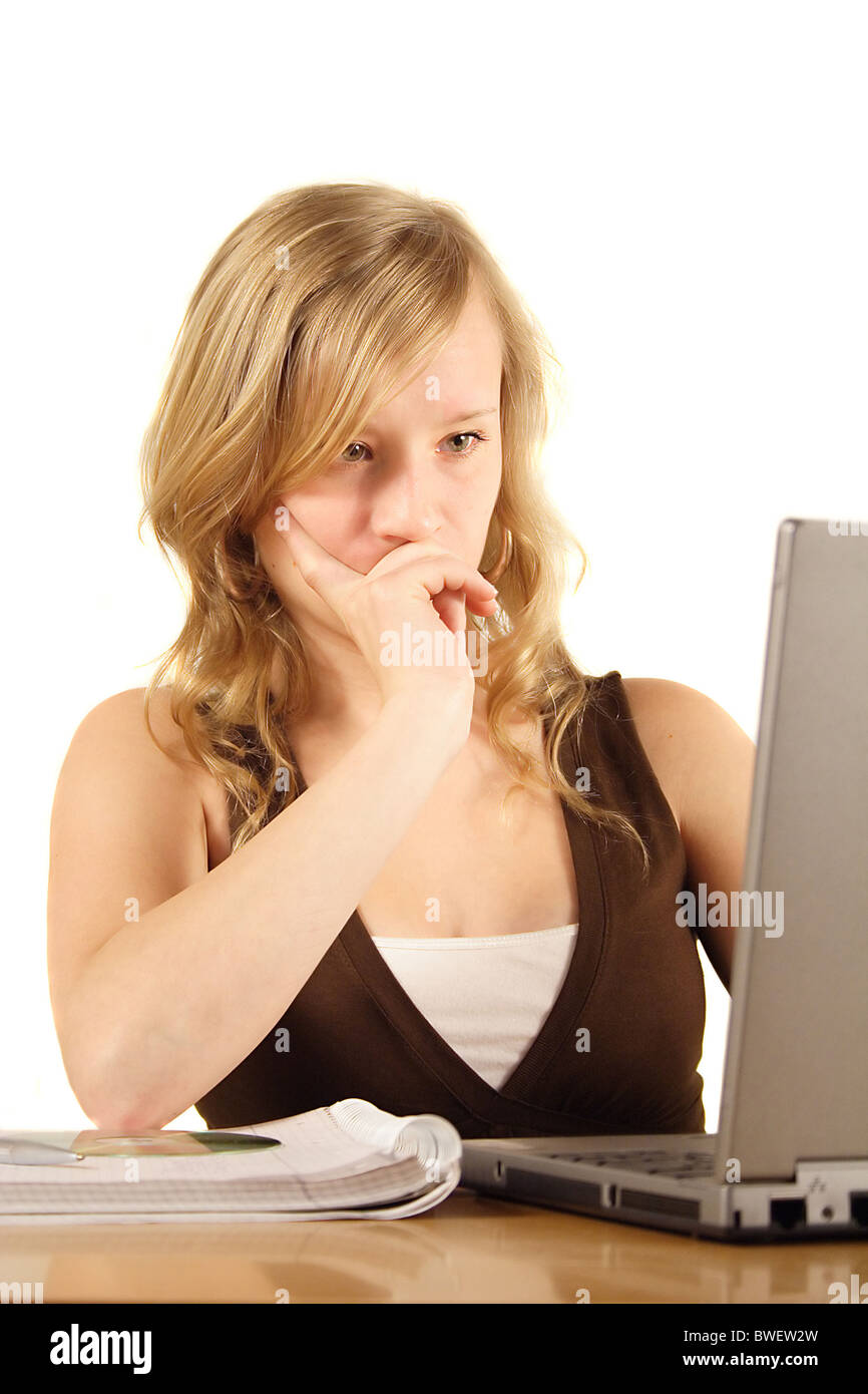 A young smarting woman at her workplace. All isolated on white ...