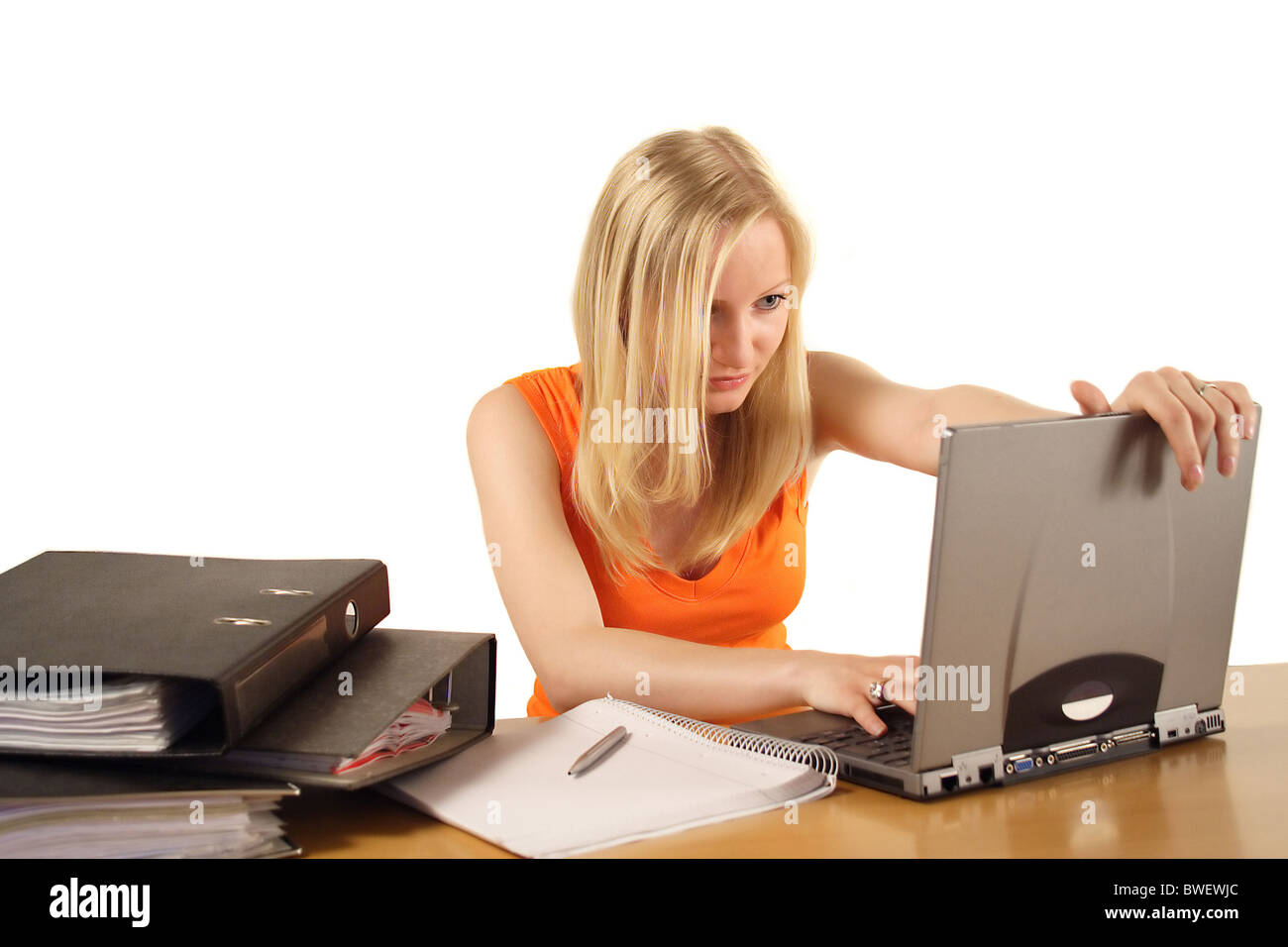 A young handsome woman got a computer problem. All isolated on white ...