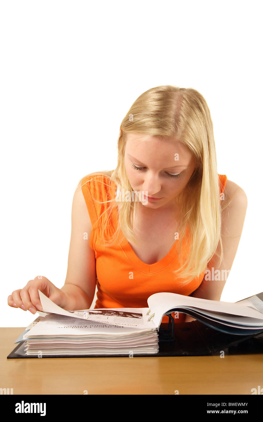 An ambitious student studying her documents. All isolated on white ...
