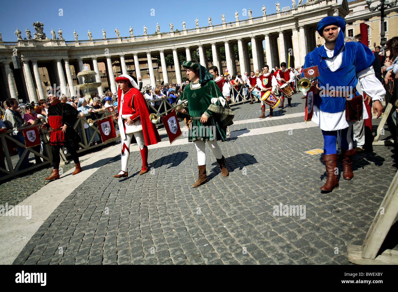 Dressed procession members making their way up to St Peter's Basilica ...